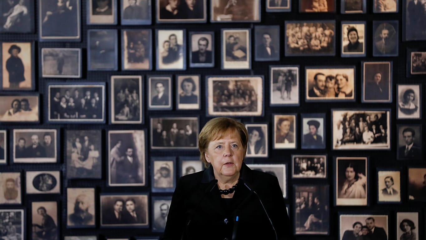 Merkel visits Auschwitz memorial for the first time after 14 years as ...
