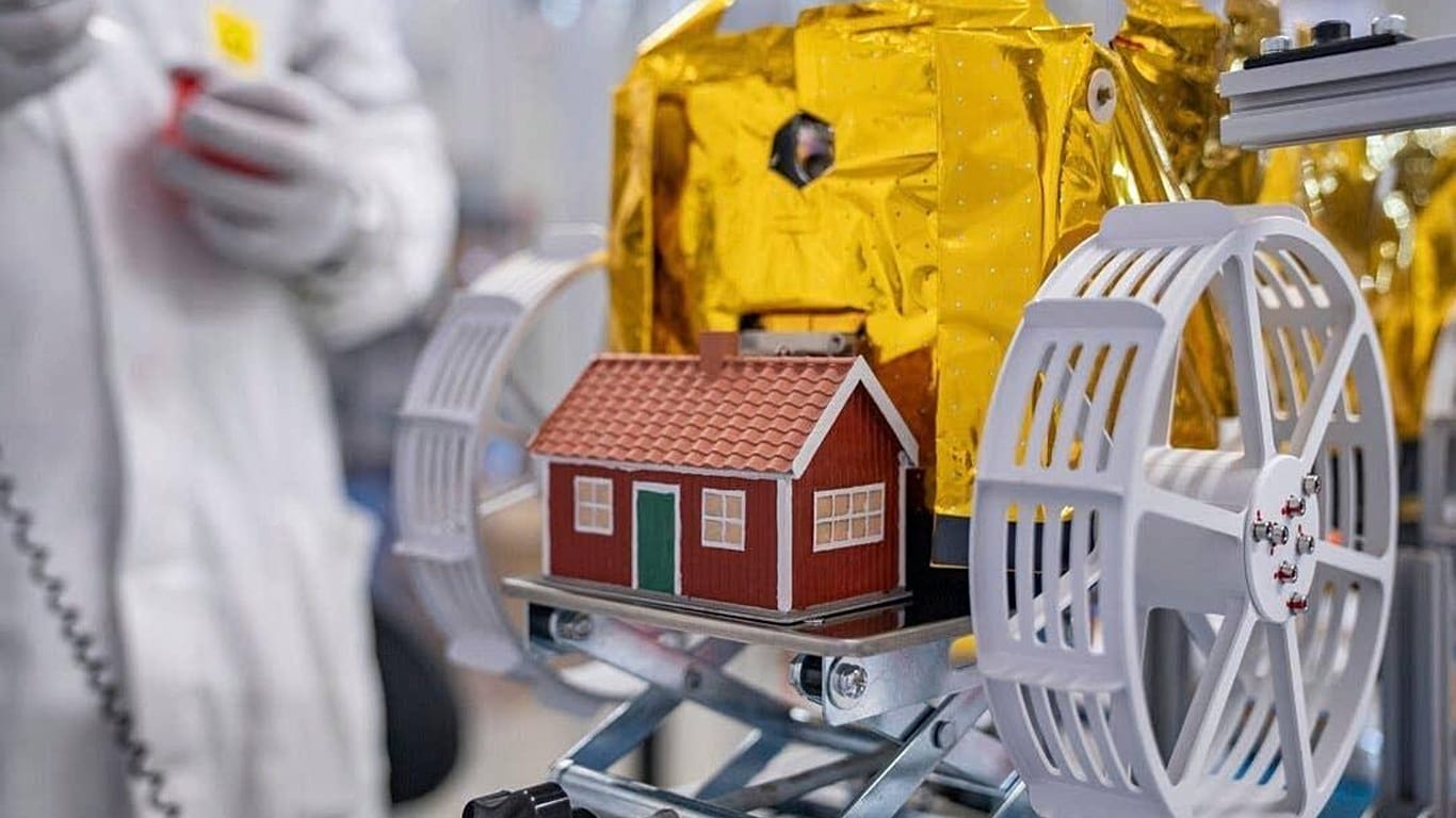 Video. Swedish artist’s dream takes flight: Tiny red house heads to the ...