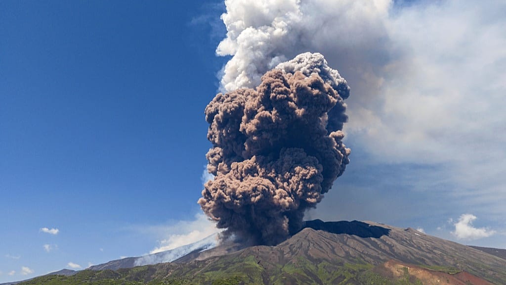 Massive plume of ash and volcanic material billows above Mount Etna as ...