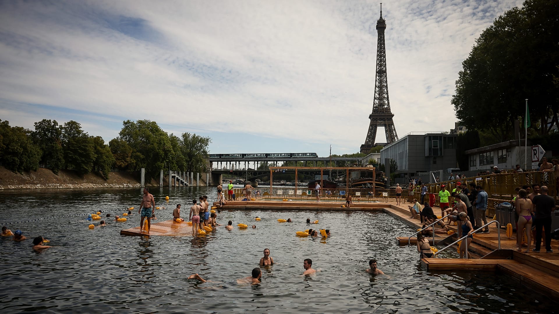 Parisians take a historic plunge into the River Seine after more than a ...