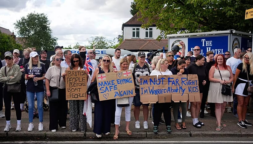 UK police arrest six people after asylum seeker hotel protest turns ...