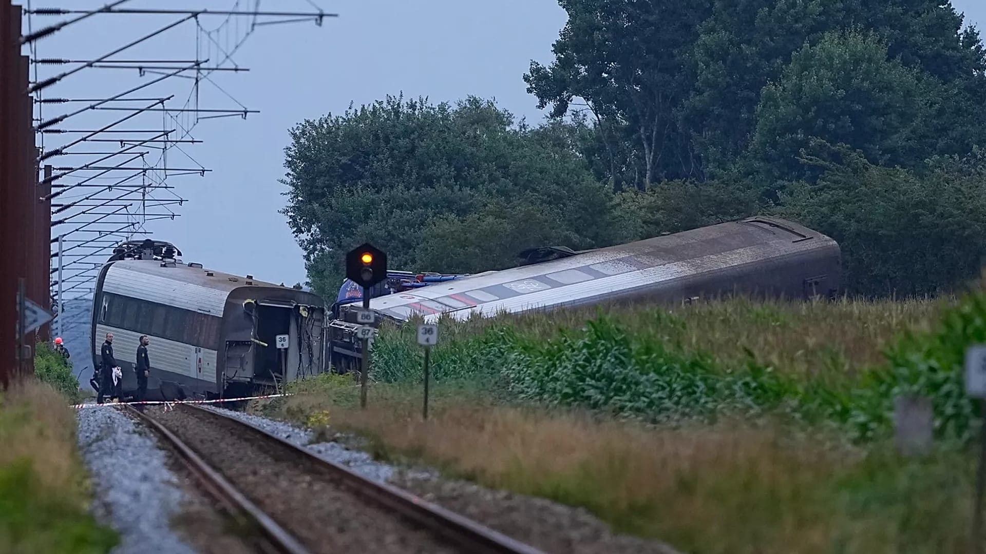 At least one person killed after train collides with tanker in Denmark ...