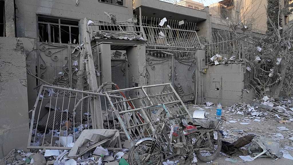 Video. Workers clear rubble after US-Israeli strikes damage buildings ...