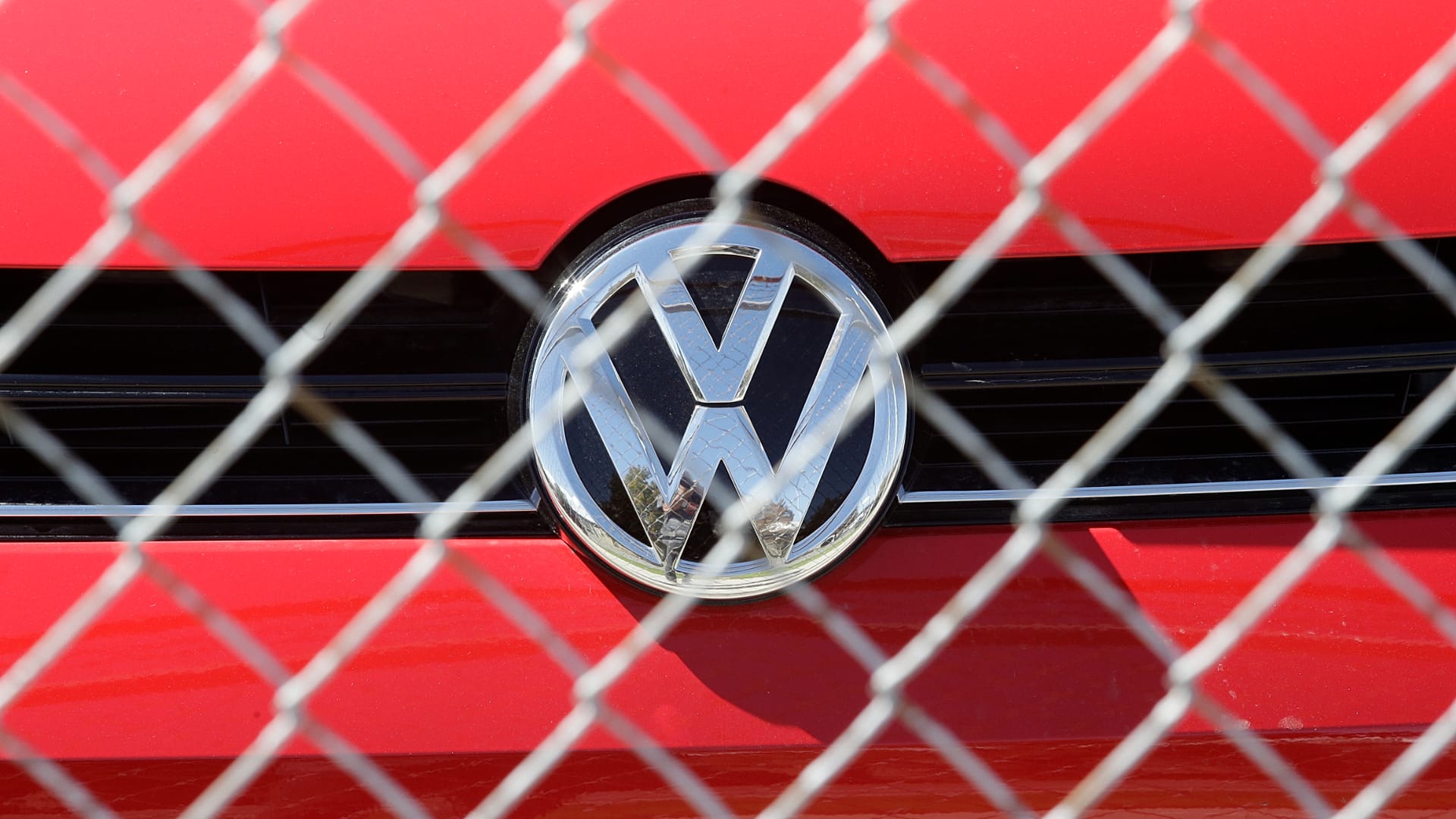 Volkswagen slashes 50,000 jobs after profits collapse by nearly half ...